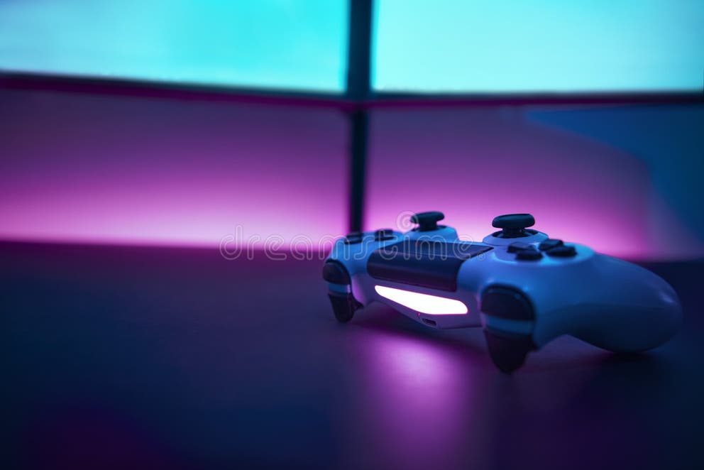 Low Angle View Game Controller on Table. Blank Dual Display and Pink ...