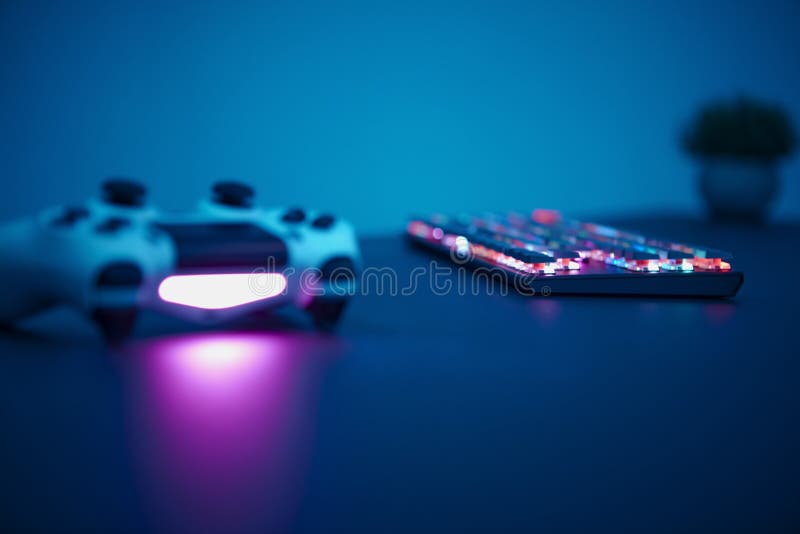 Low Angle View of Gaming Controller and Keyboard Laying on Table. Low ...
