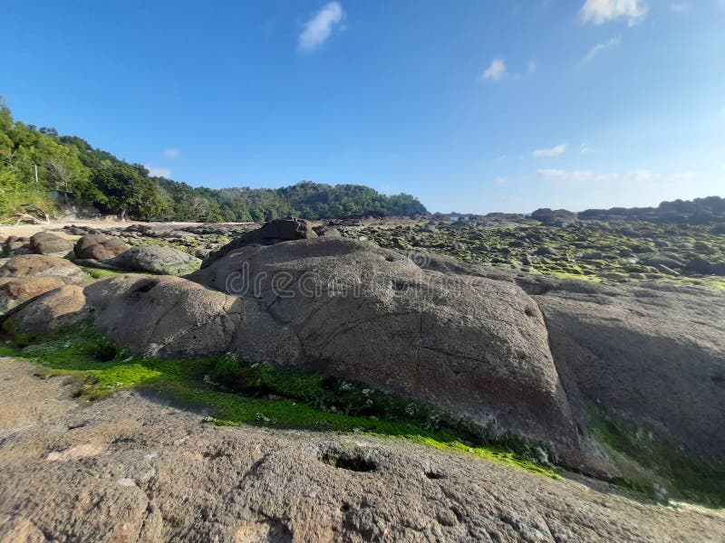Low Angle View from Grey Ball Shaped Rock Stones at a Rocky Sand Beach ...