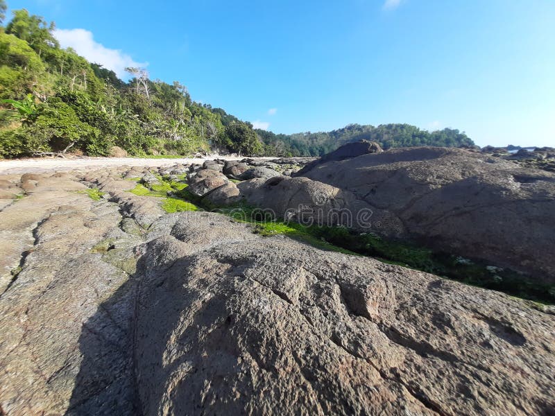 Low Angle View from Grey Ball Shaped Rock Stones at a Rocky Sand Beach ...