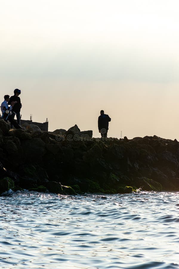 Low Angle View Group People Cliff Facing Sea Stock Photos - Free ...