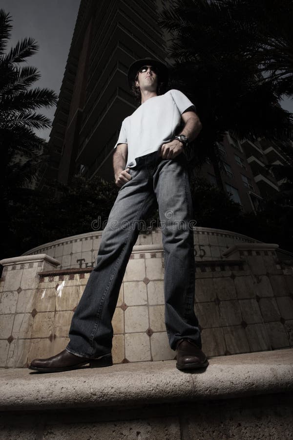 Low Angle View of a Handsome Man Stock Image - Image of young, jeans ...