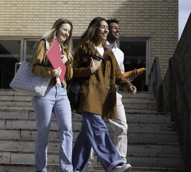 Low Angle View of Happy Diverse University Students Walking and Talking ...