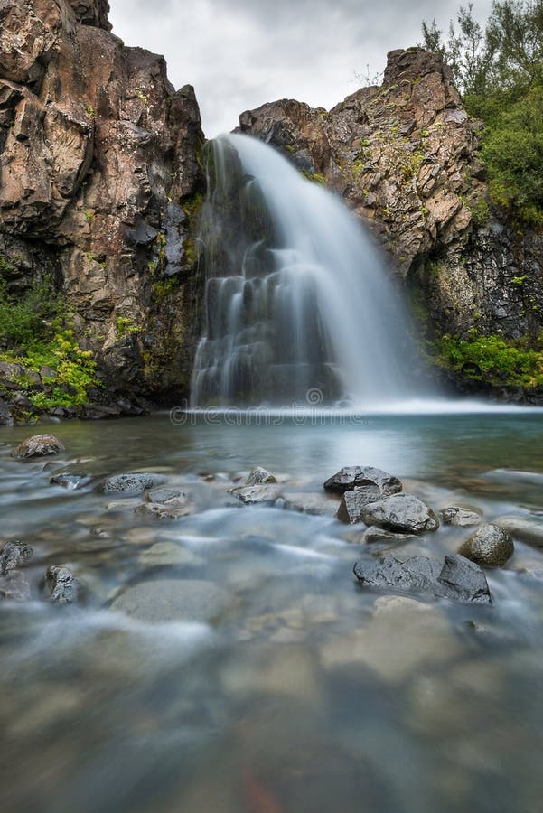 Low Angle View of an Icelandic Waterfall at Summer Stock Image - Image ...