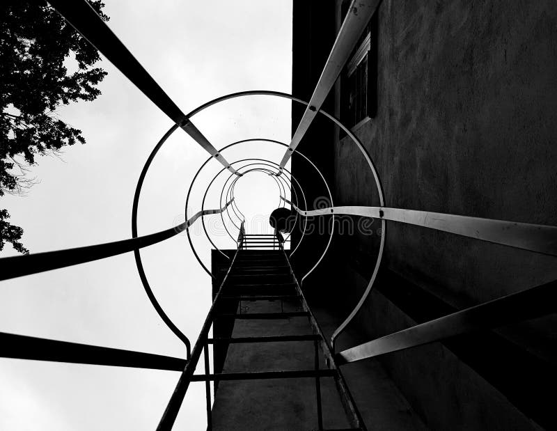 Low Angle View of a Ladder on the Outside of a Building Stock Photo ...