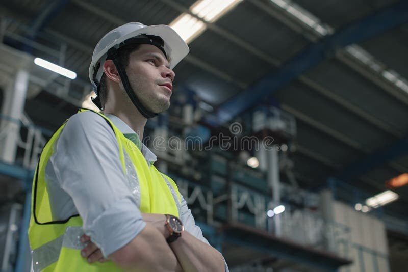 Low Angle View of a Male Technical Engineer Standing in the Factory ...