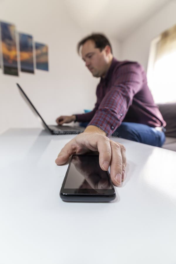 Man Getting a Call and Taking His Mobile Phone Stock Photo - Image of ...