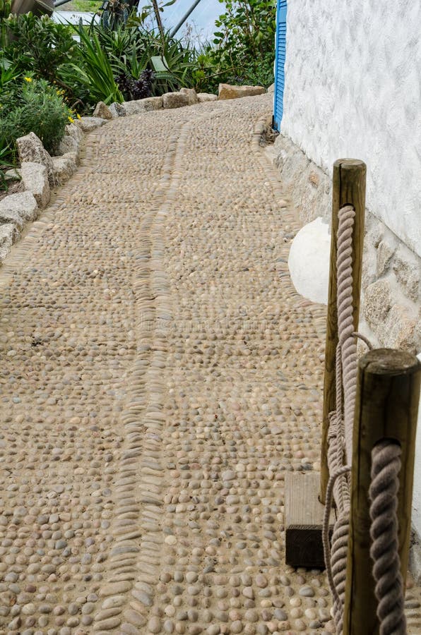 Low Angle View Of Mediterranean Pebble Cobble Path White Wall An Stock ...