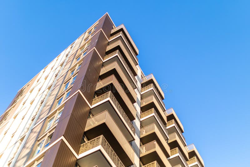Low-angle View of a Modern Building with Multiple Balconies on the Side ...