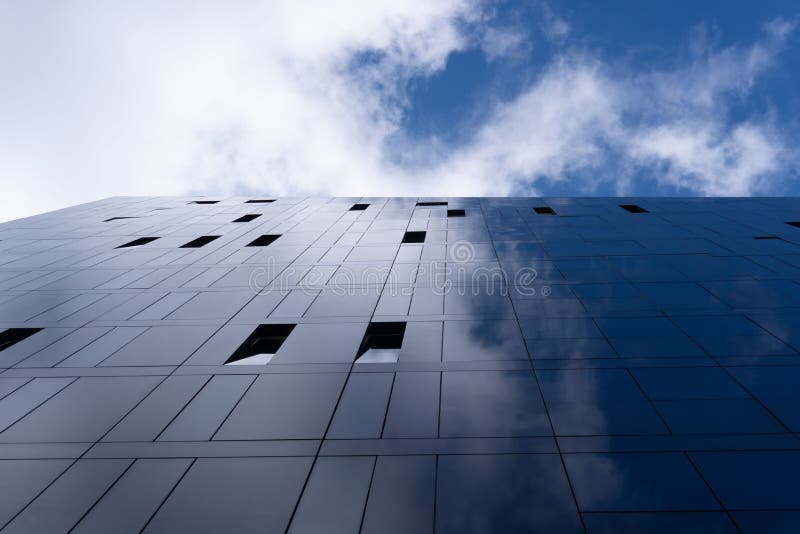 Modern, Reflective Glass Building with a Huge Window Displaying the ...