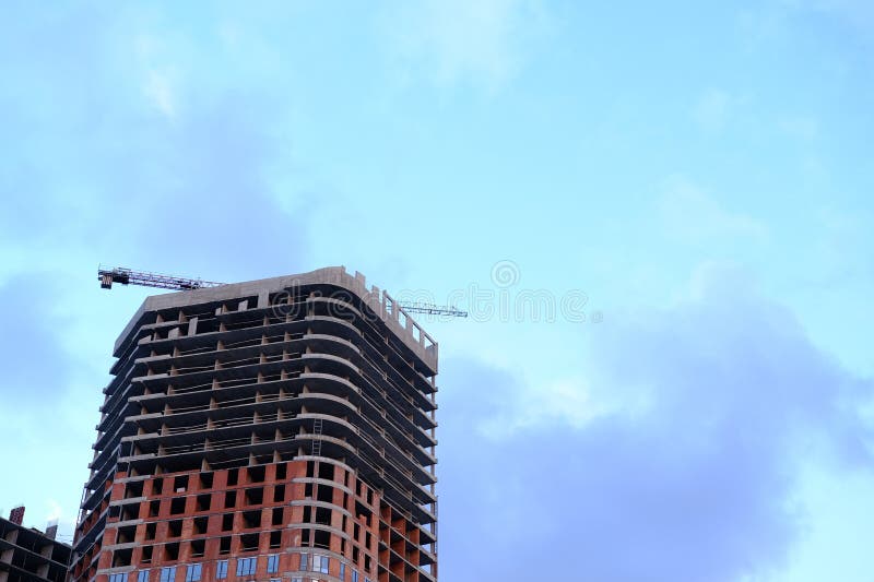 Low Angle View of Modern Office Building by Construction Site Against ...