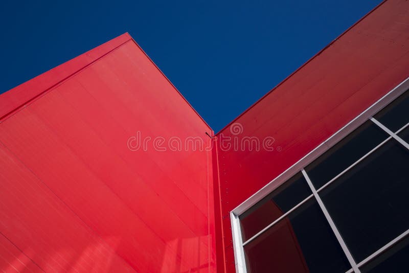 Low Angle View of Modern Office Building with Red Facade Stock Photo ...