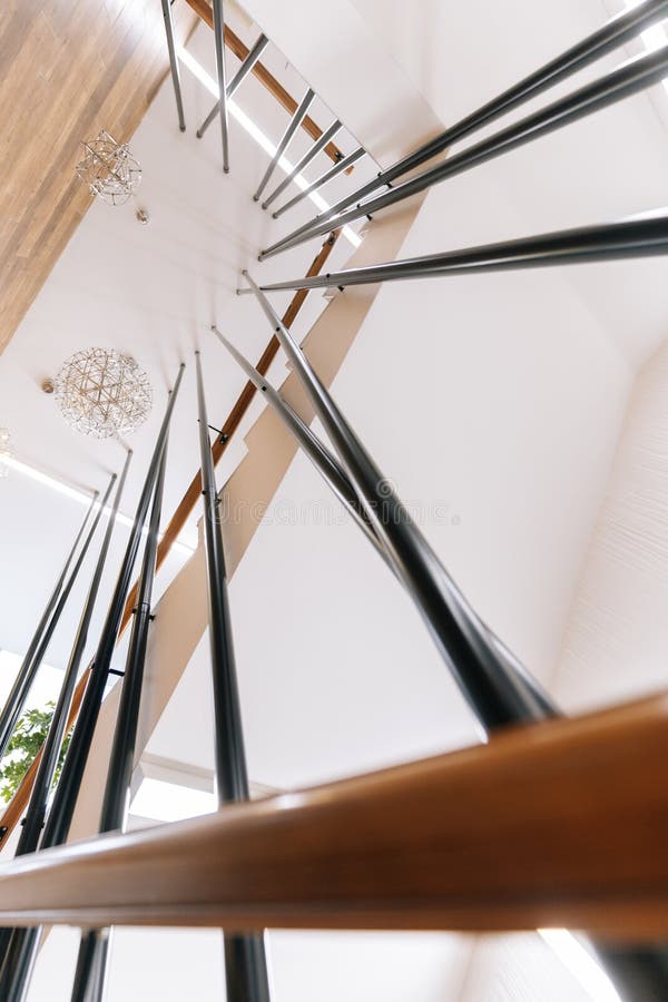 Low-angle View of Modern Staircase Featuring Wooden Railing and ...