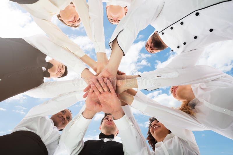 Multiracial Restaurant Staff Stacking Hands Stock Photo - Image of ...