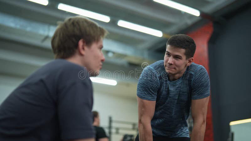 Low-angle View of Muscular Personal Instructor Explaining Technique of ...