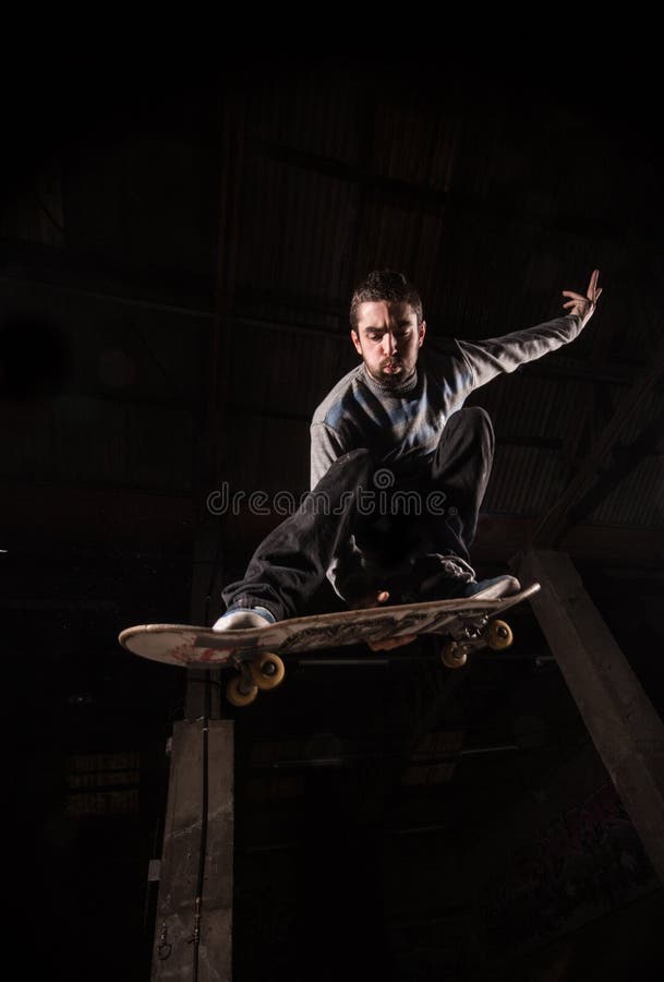 Low Angle View of Ollie with Backside Grab Trick Stock Photo - Image of ...