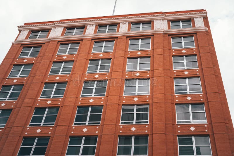 Low-angle View of an Orange Colored Building Facade with Square Windows ...