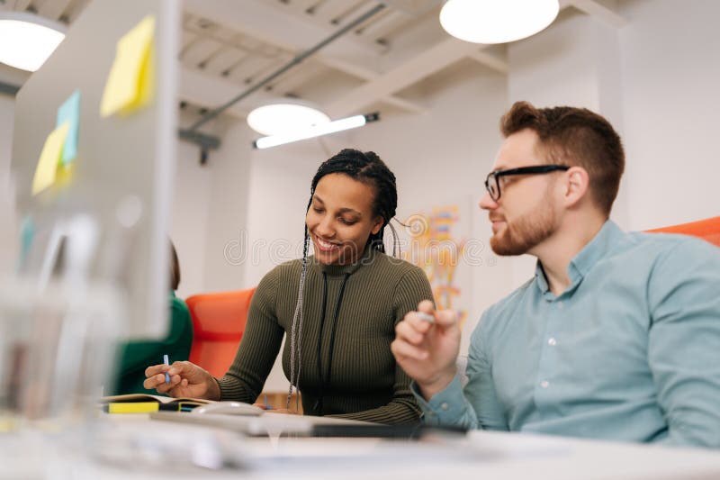 Low-angle View of Positive Creative Diverse Colleagues Team Discuss ...
