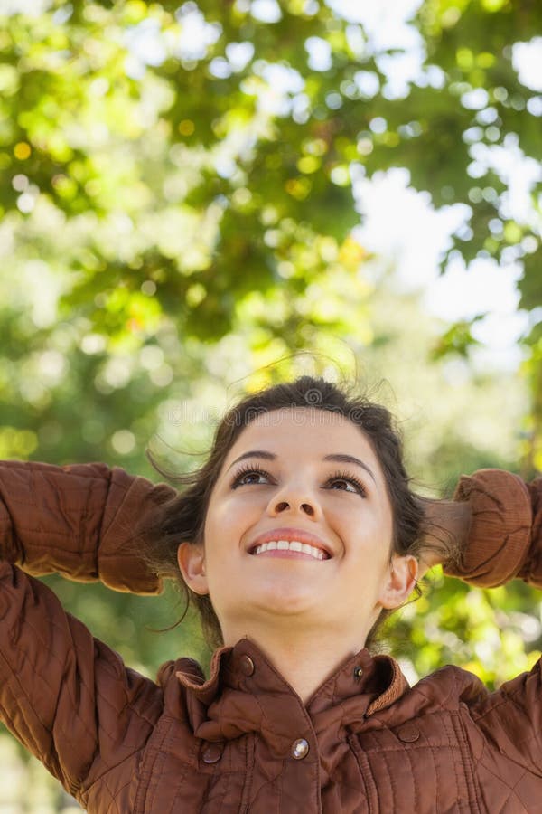 Low Angle View of Pretty Woman Posing in a Park Stock Photo - Image of ...