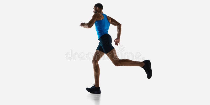 Low Angle View of Professional Runner, Body Fully Engaged in Intense ...