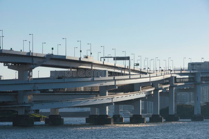 Low-angle View of Rainbow Bridge Above the Water in Tokyo, Japan Stock ...