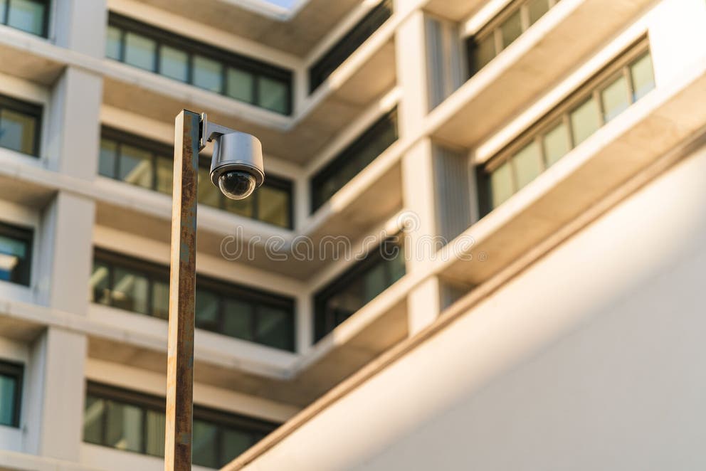 Low-angle View of a Security Camera Column by a Residential Building ...