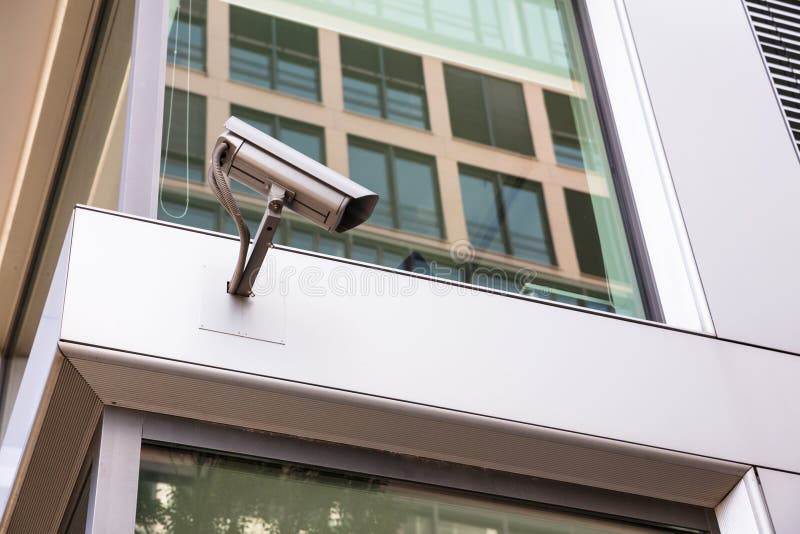 Security Camera Mounted on Office Building in City Stock Photo - Image ...