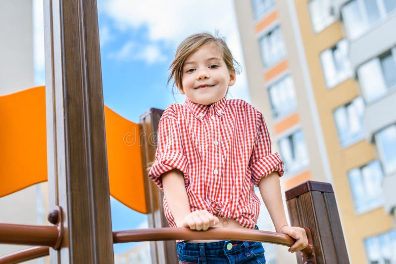 Low Angle View of Smiling Little Kid Having Fun Stock Photo - Image of ...