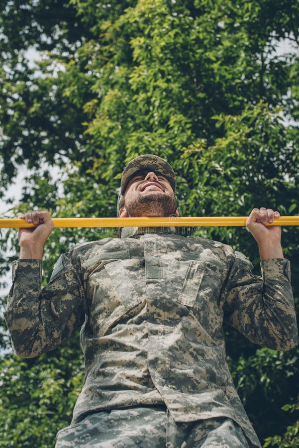 Low Angle View of Soldier in Military Uniform Pulling Himself Up Stock ...