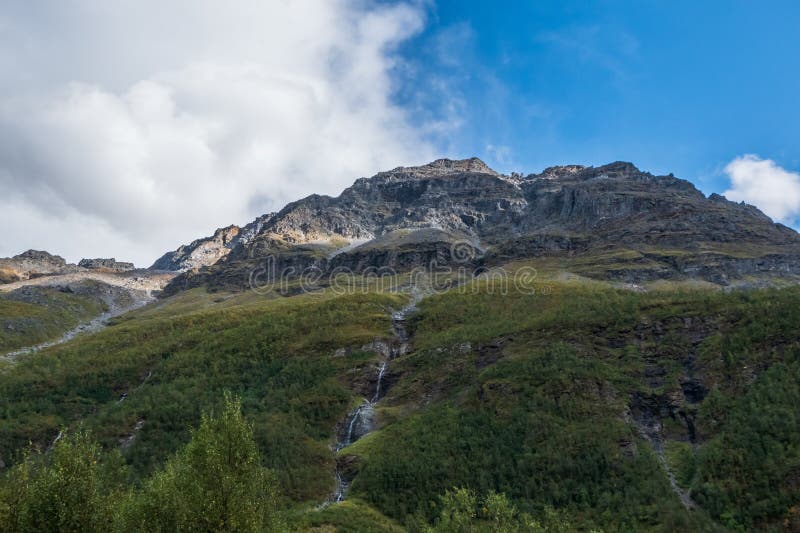 Low Angle View of Steep Mountain Side. Waterfall in the Middle Stock ...