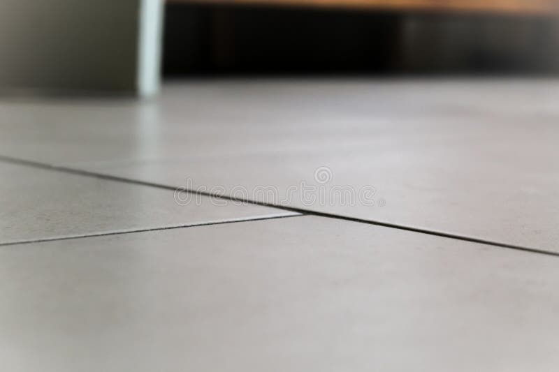 Low Angle View of Tile Flooring with Reflection Minimalist ...