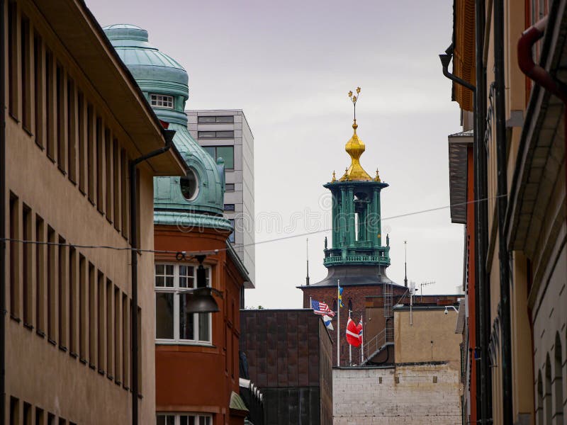Low Angle View of a Tower Seen between Buildings Stock Image - Image of ...