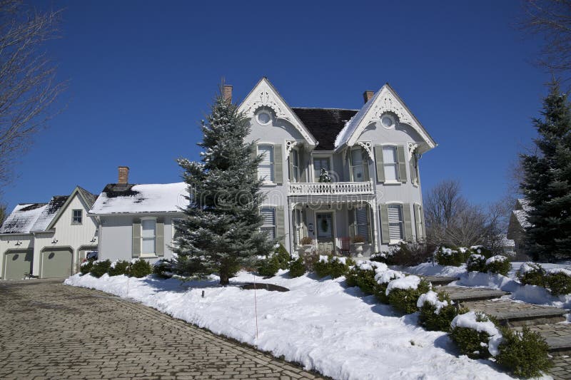 Low Angle View of the Victorian Style House with Deep Snow in Winter ...