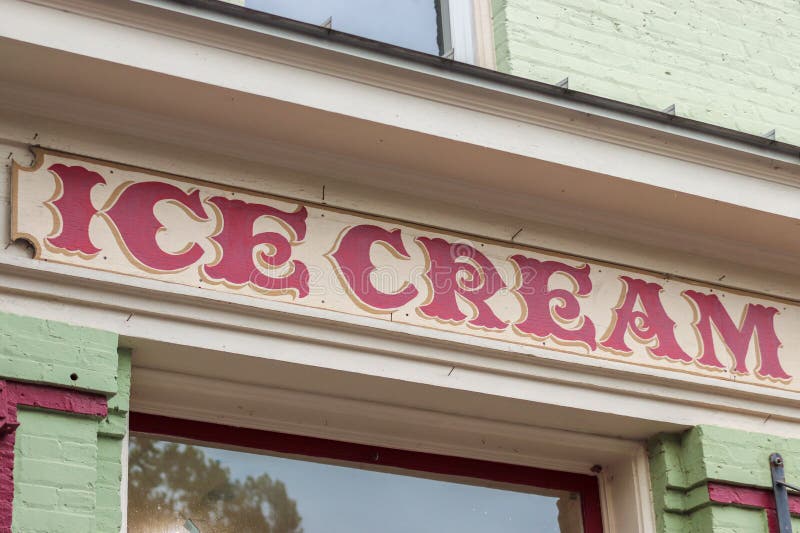 Low-angle View of a Vintage-style Ice Cream Store Sign on the Facade ...