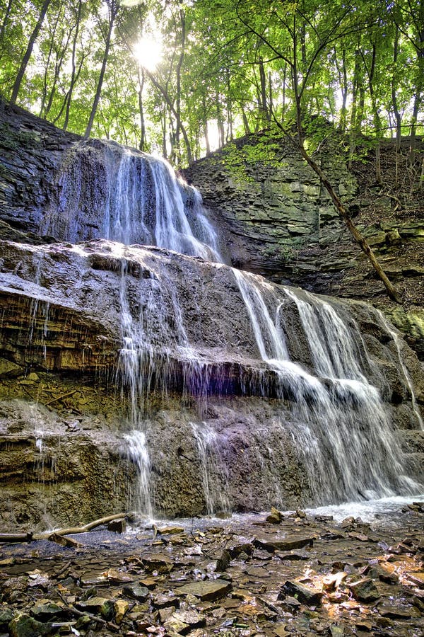 Low-angle View of a Waterfall with Lens Flare Stock Photo - Image of ...