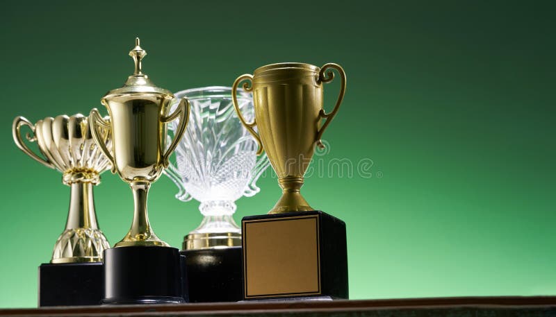Low Angle View Winning Trophy Against Green Background Stock Image ...