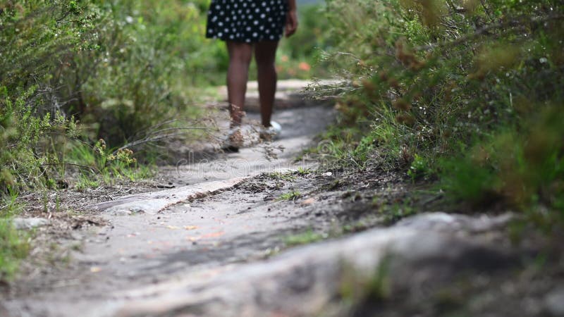 Low Angle View of Woman Seen Walking through Path Stock Video - Video ...