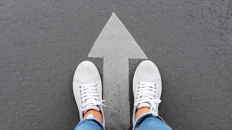 Woman Standing on Asphalt Road, White Arrow Pointing Ahead, Symbolizing ...
