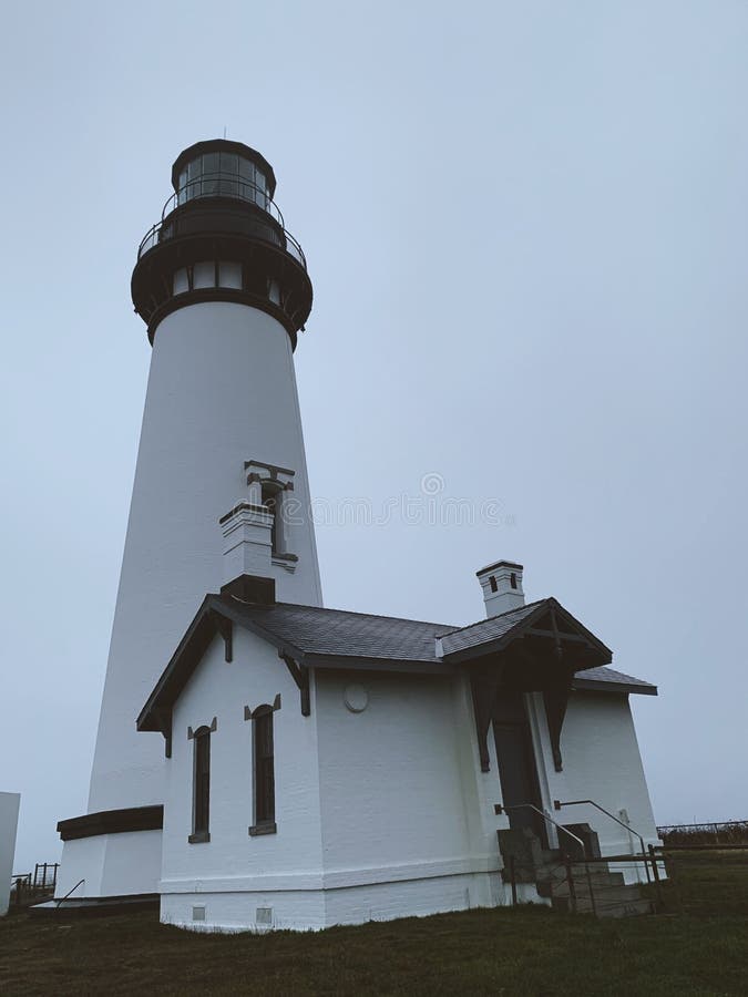 Low Angle of Yaquina Head Lighthouse on a Gloomy Day Stock Image ...