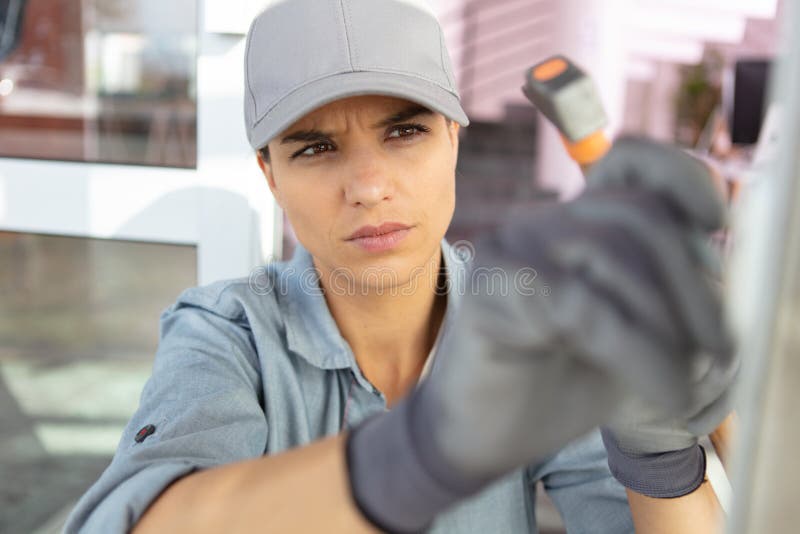 Low Angle Young Woman Working Installing Windows Stock Image - Image of ...
