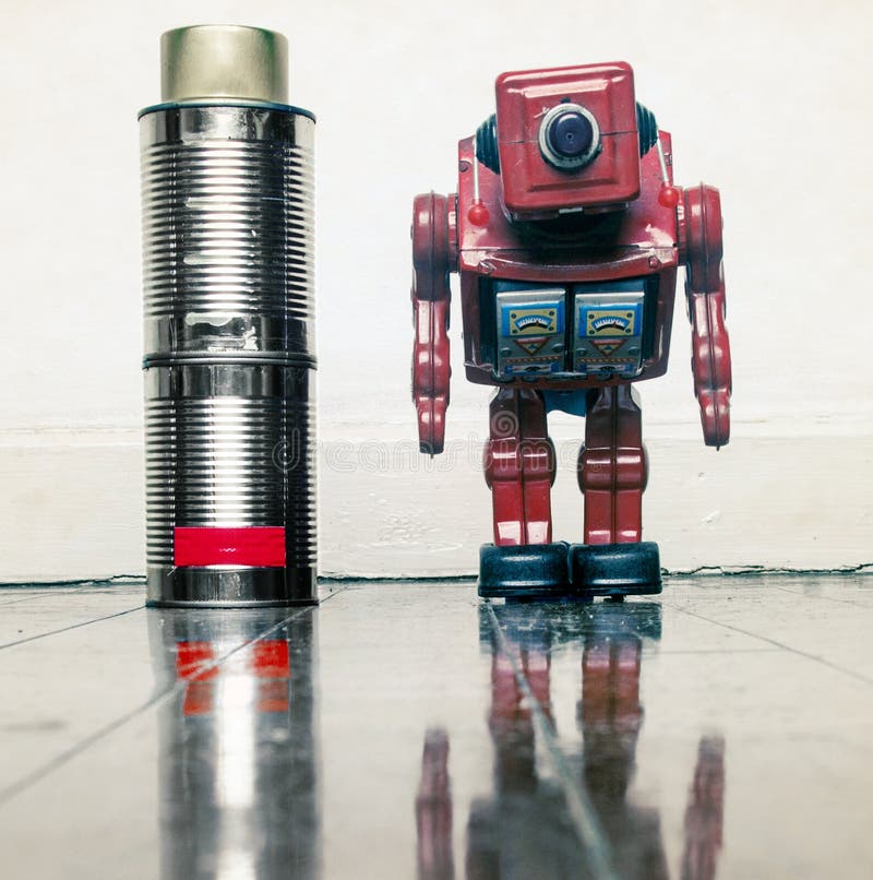 Low Battery Concept with Old Tin Cans and a Retro Robot Stock Photo ...