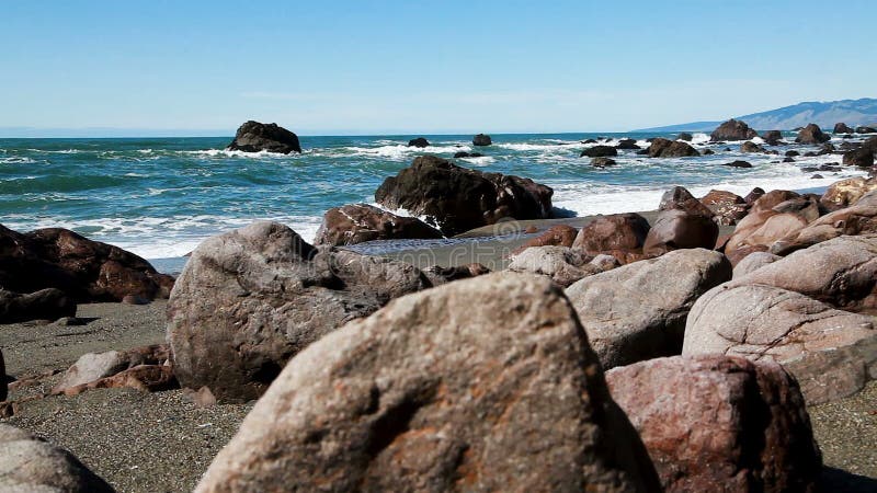 Low Camera Angle Rocks on Beach with Ocean Waves Stock Footage - Video ...