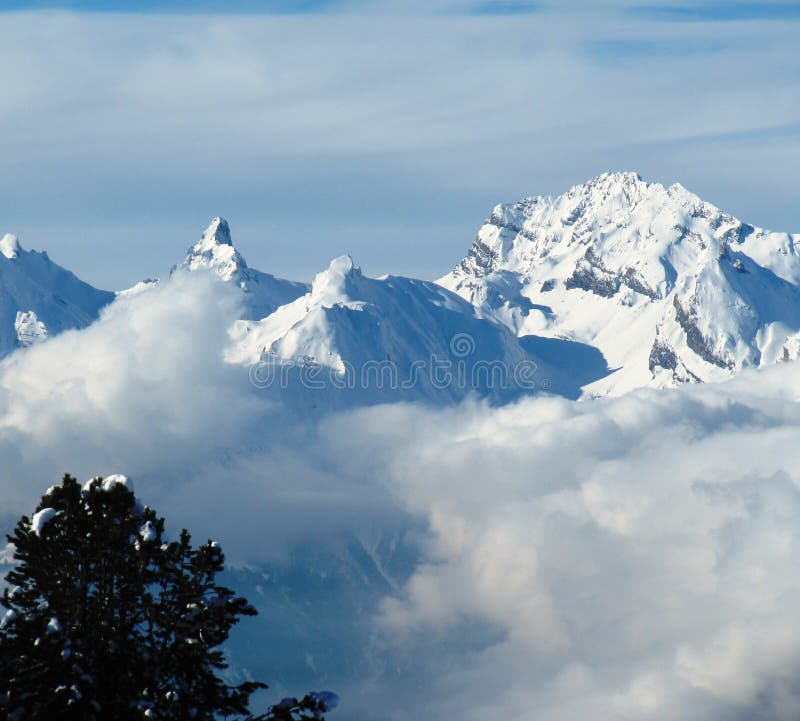 A Winter Alpine Mountain Scene Under a Blue Sky Stock Image - Image of ...