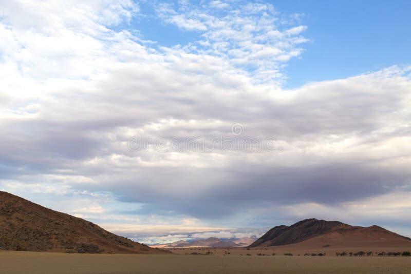 Low clouds in the desert stock image. Image of camel - 139744333