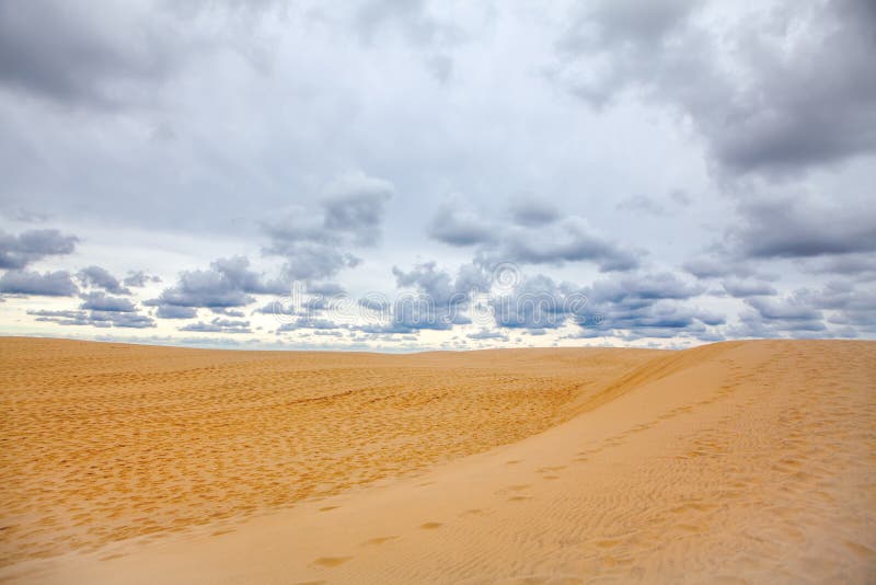 Low clouds and sandy beach stock image. Image of color - 158154915