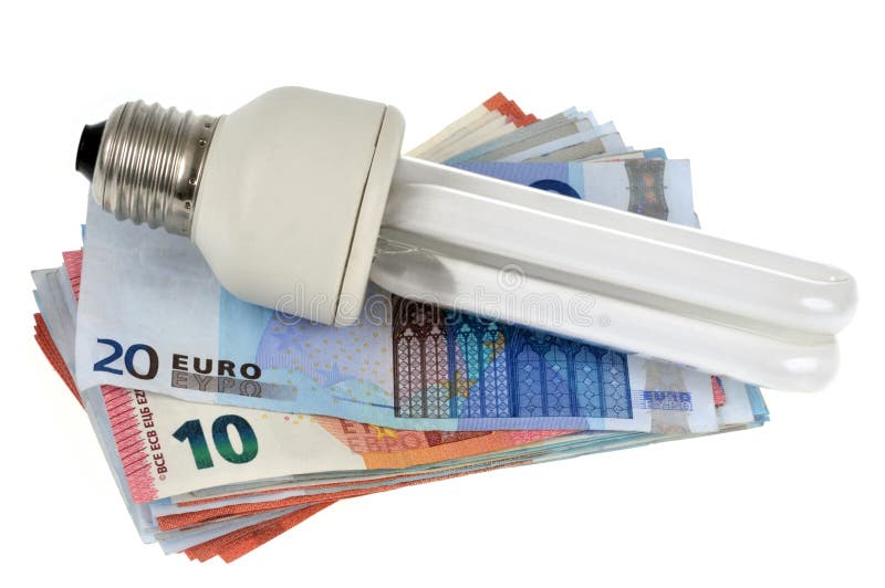 Low Consumption Light Bulb Placed on a Wad of Banknotes Stock Photo ...