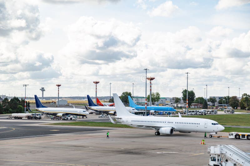 Low-cost Airplanes Queue for Loading on Airfield Editorial Stock Image ...