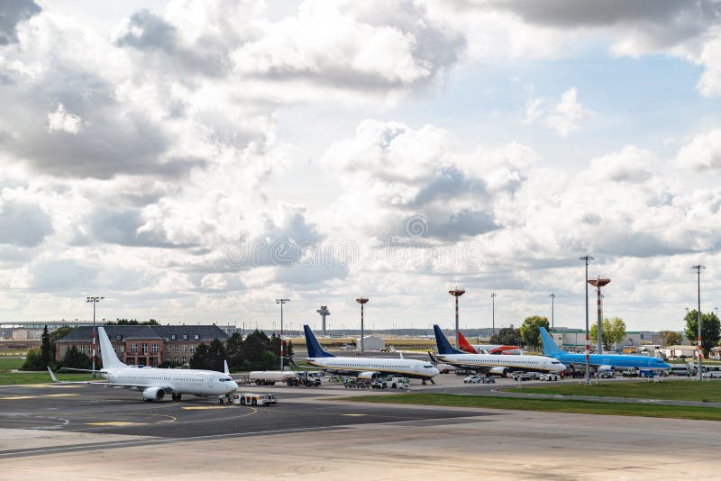 Low-cost Airplanes Queue for Loading on Airfield Editorial Photography ...