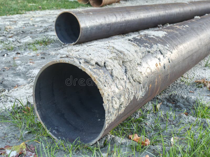 Metal Pipe Stack on Soil. Rounded Iron Pipe Shape Ready for Use Stock ...
