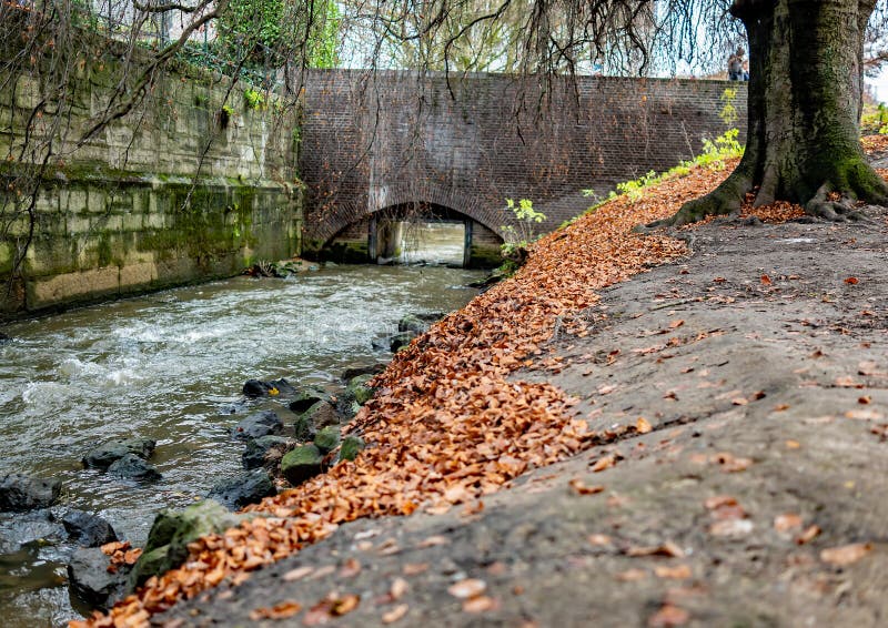 Low Down View of Stone Bridge Over Flowing River Stock Photo - Image of ...